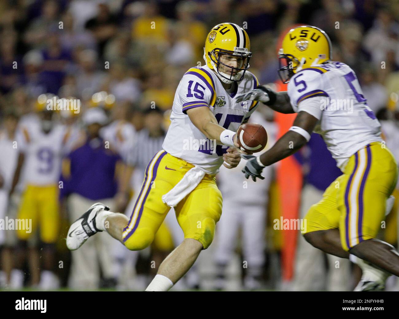 LSU quarterback Matt Flynn hands off to running back Keiland Williams ...