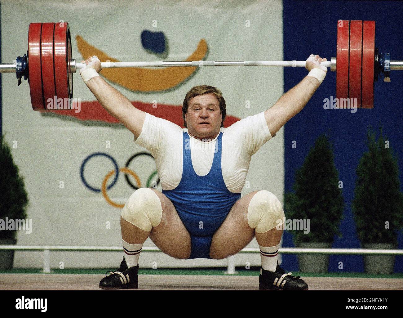 Mitko Raikov Mitev of Bulgaria lifts the weights in the super ...