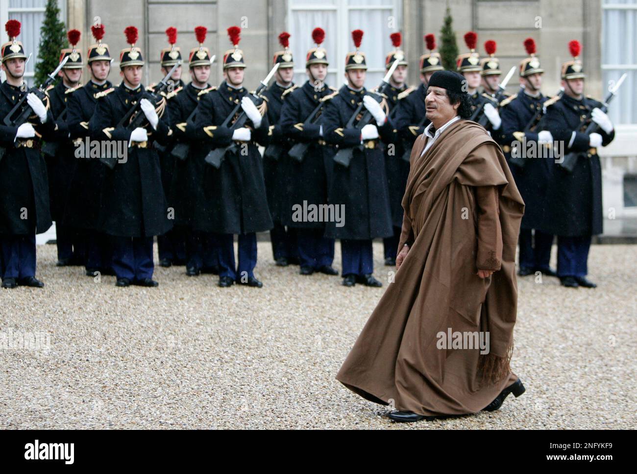 Libyan leader Col. Moammar Gadhafi reviews French Republican Guards ...