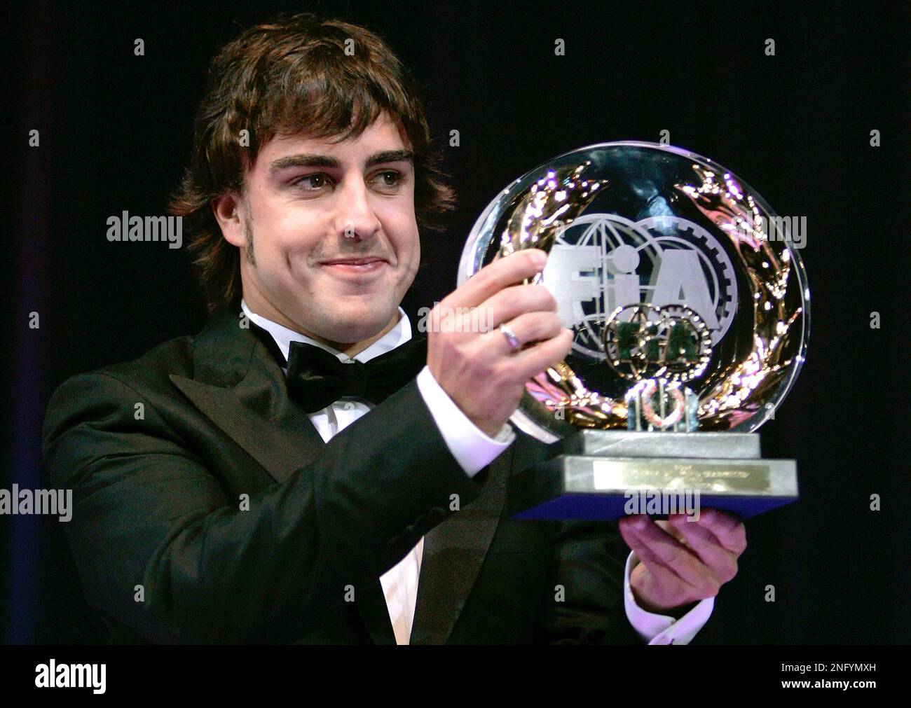 Spanish Formula One driver Fernando Alonso, holds his FIA Formula One ...