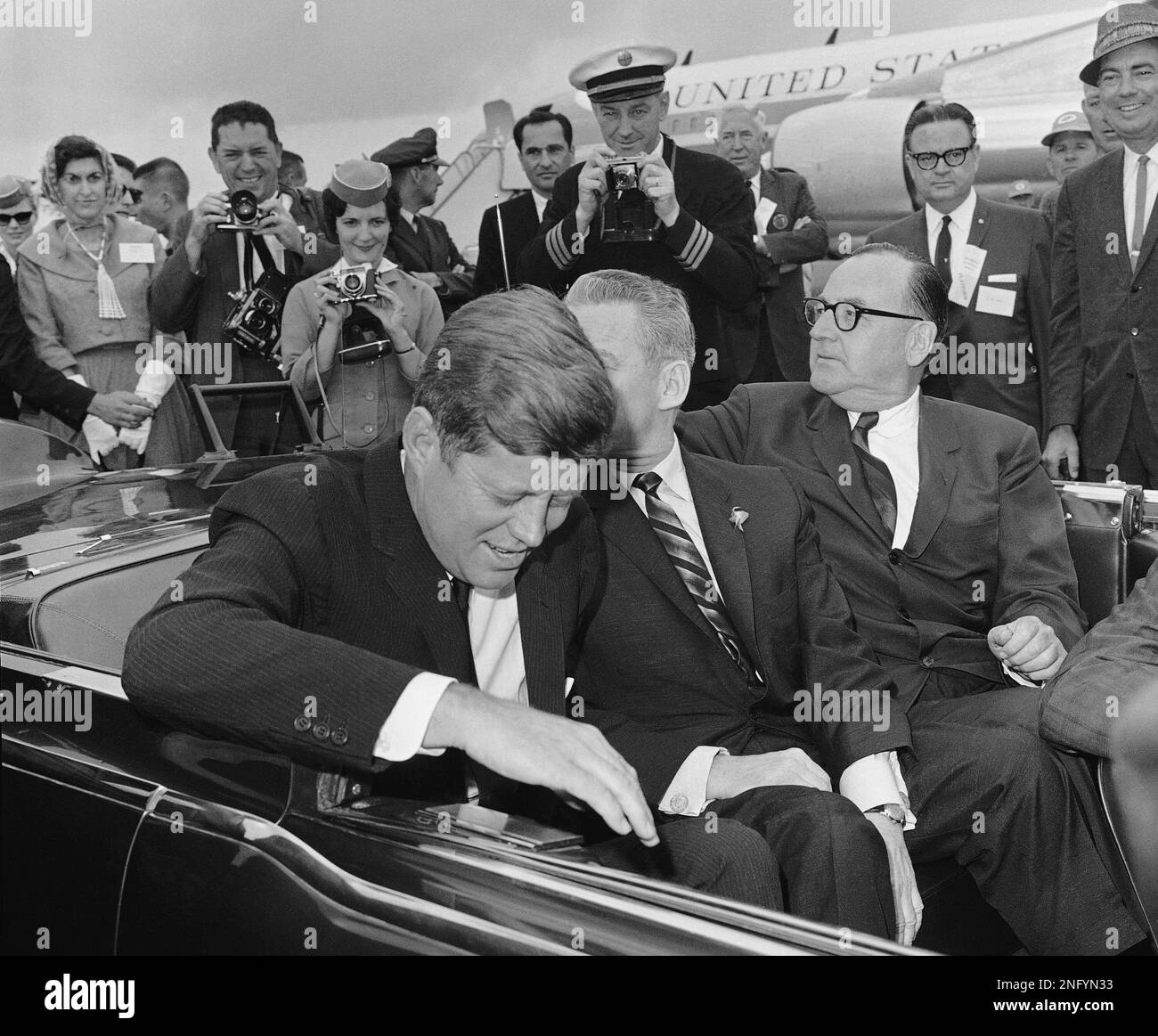 President John Kennedy in car with Calif. Gov.Edmund "Pat" Brown, right ...