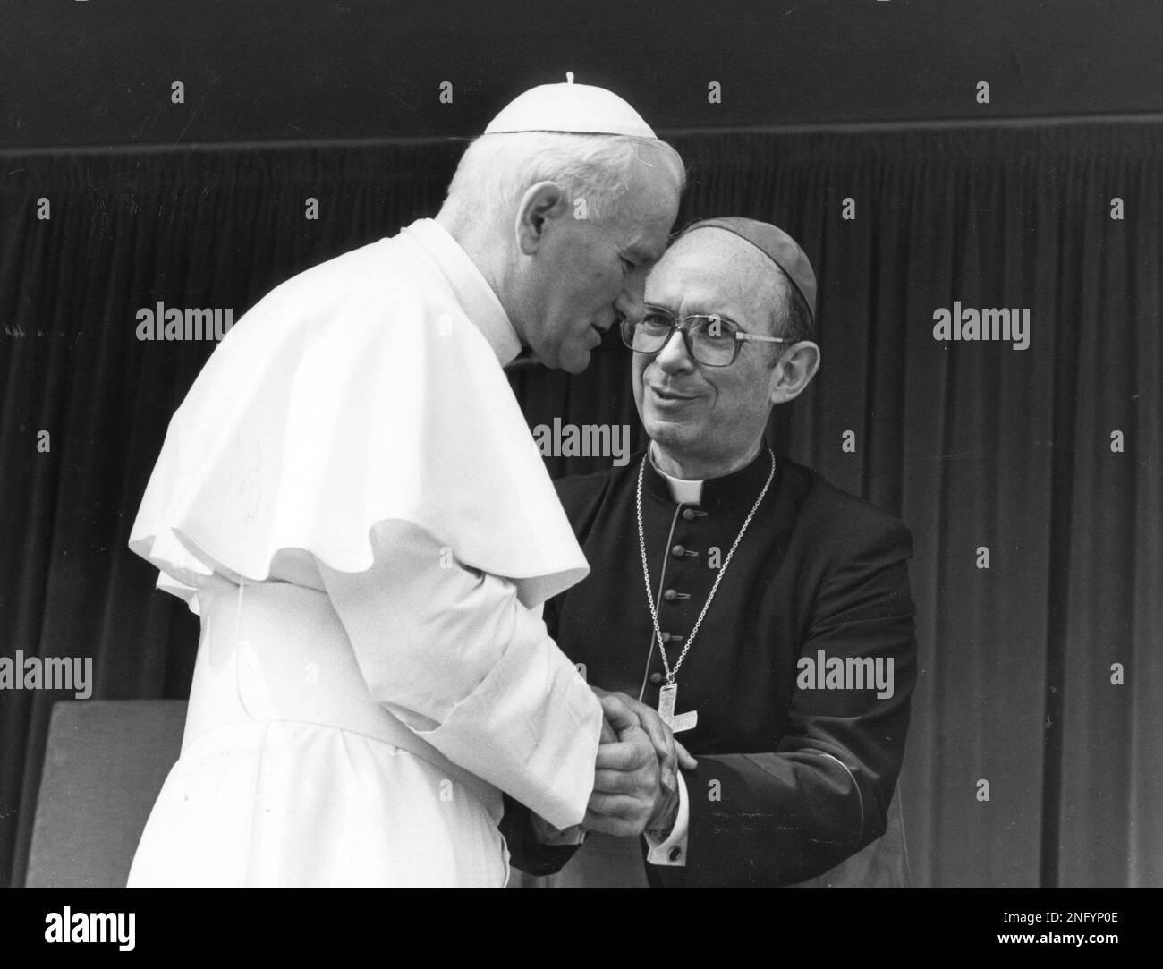 Archbishop Joseph L. Bernardin, of Chicago, right, shakes hands with ...