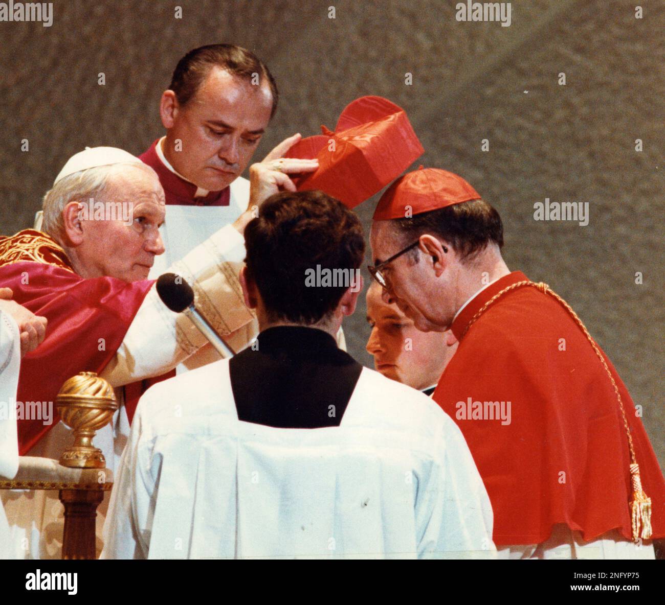 Archbishop Joseph L. Bernardin, of Chicago, receives the Biretta from ...