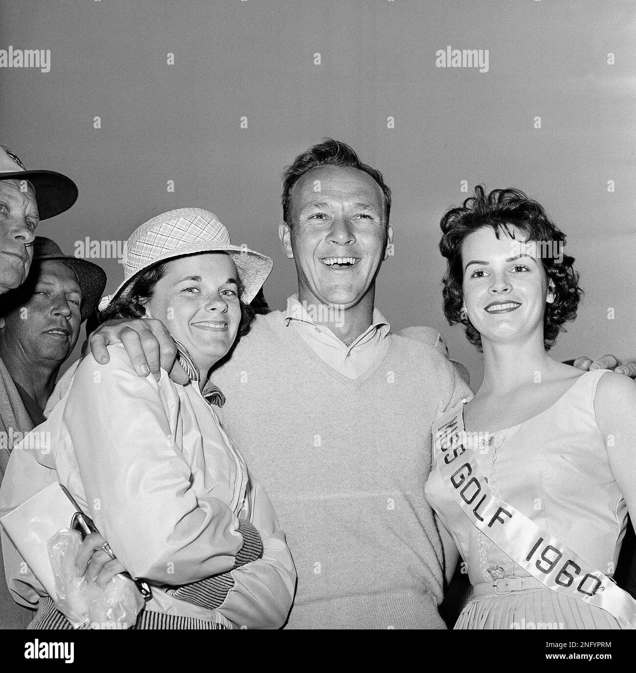 Arnold Palmer, center, smiles happily with his wife Winnie, left, and ...