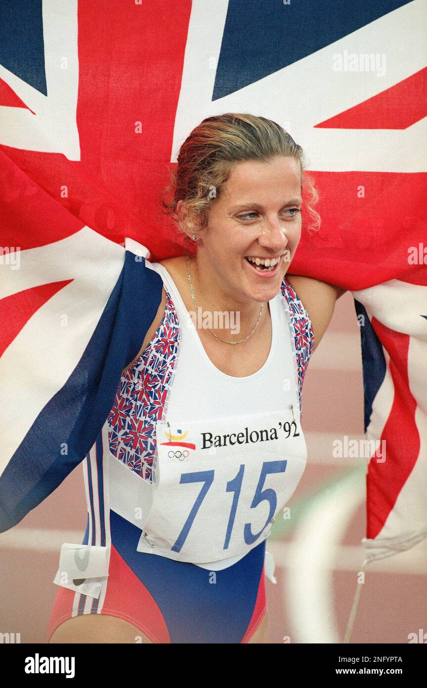 Gold medallist Sally Gunnell of Great Britain is draped in the British ...