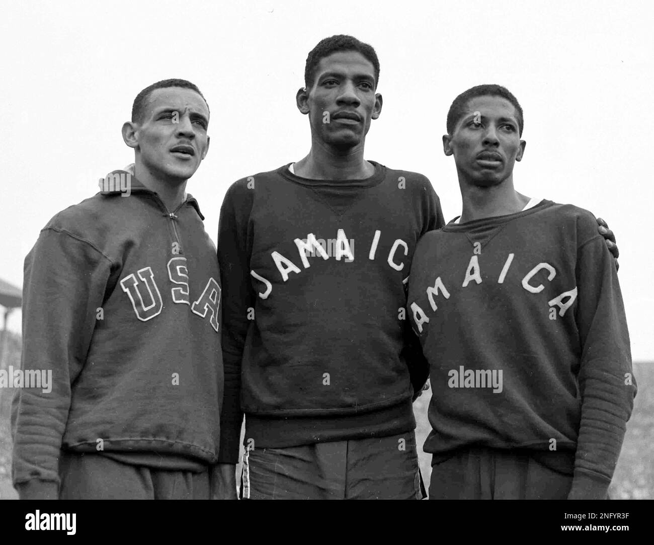 Arthur Wint, centre, gold medal, and Herb McKenley, right, silver medal ...