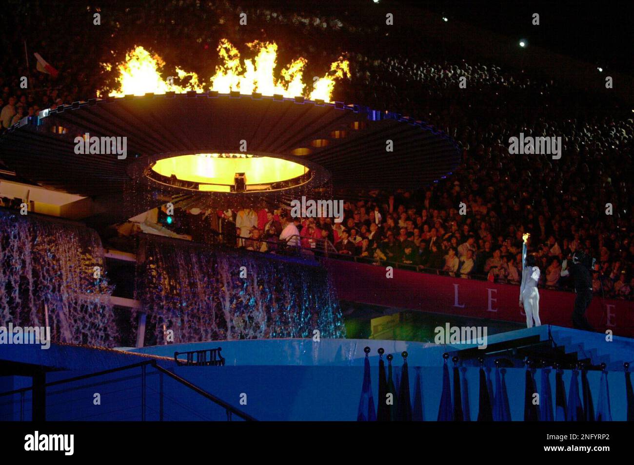 Australian Cathy Freeman watches as the cauldron carrying the Olympic ...