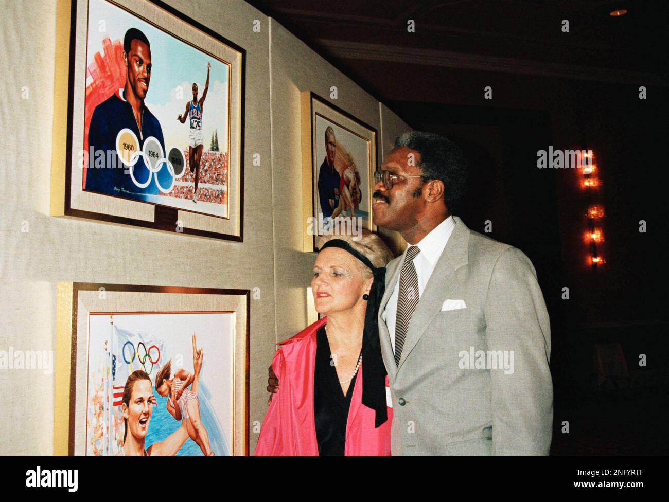 Pat McCormick, left, and Ralph Boston pose near artwork at the Olympic ...