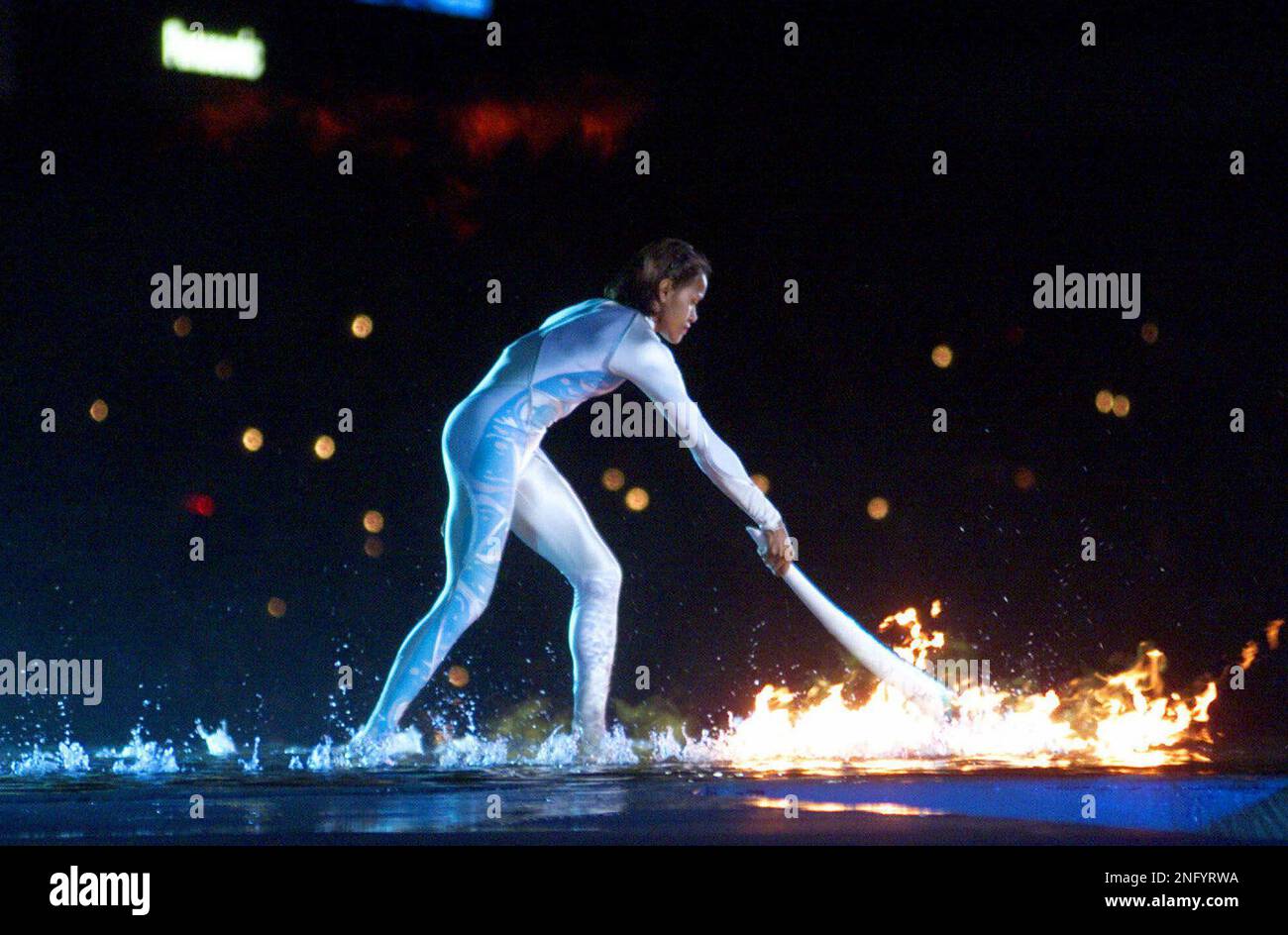 Australian Olympic athlete Cathy Freeman ignites the Olympic flame ...