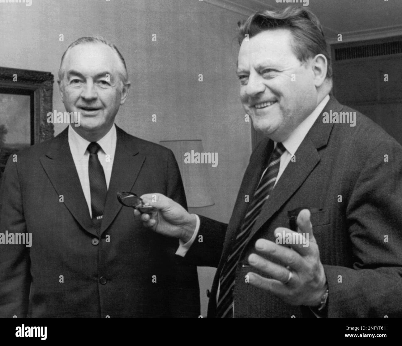 U.S. American finance minister Maurice Hubert Stans, left, talks to ...