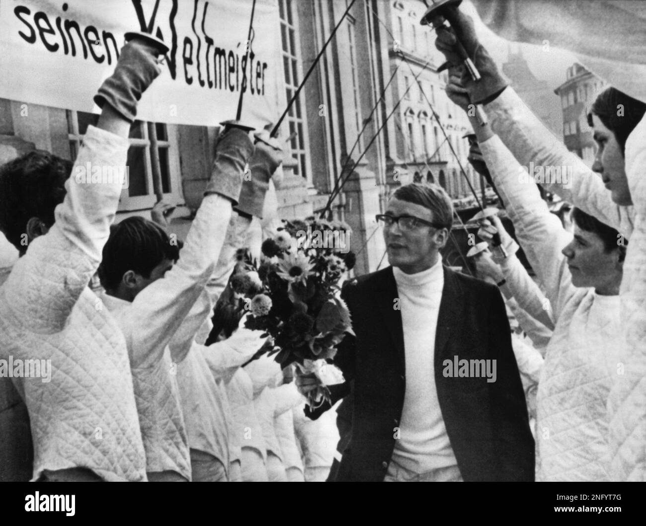 West German fencing world champion Fritz Wessel, is welcomed by young ...