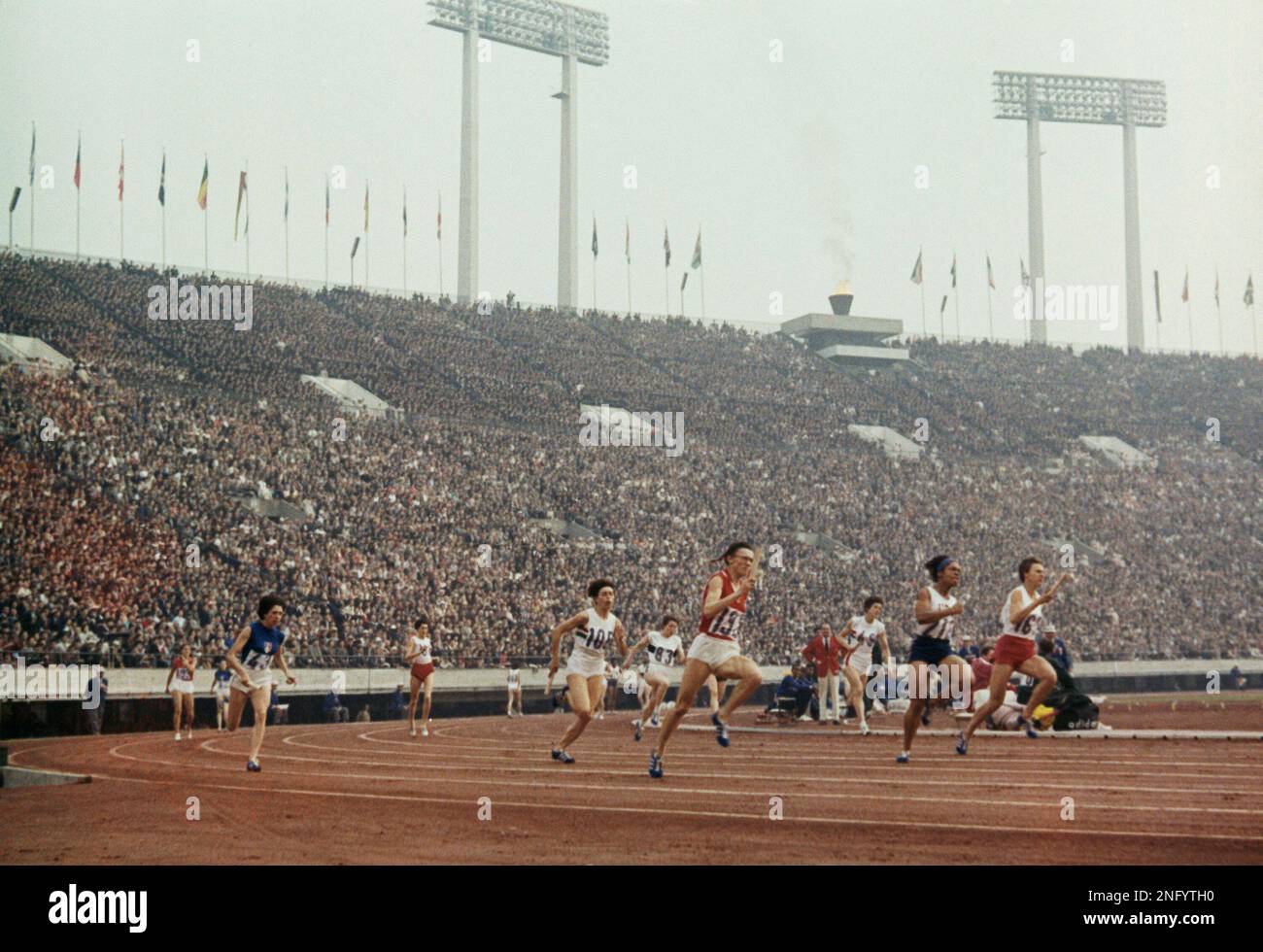 General view of crowds and athletes during running of women's 400 ...