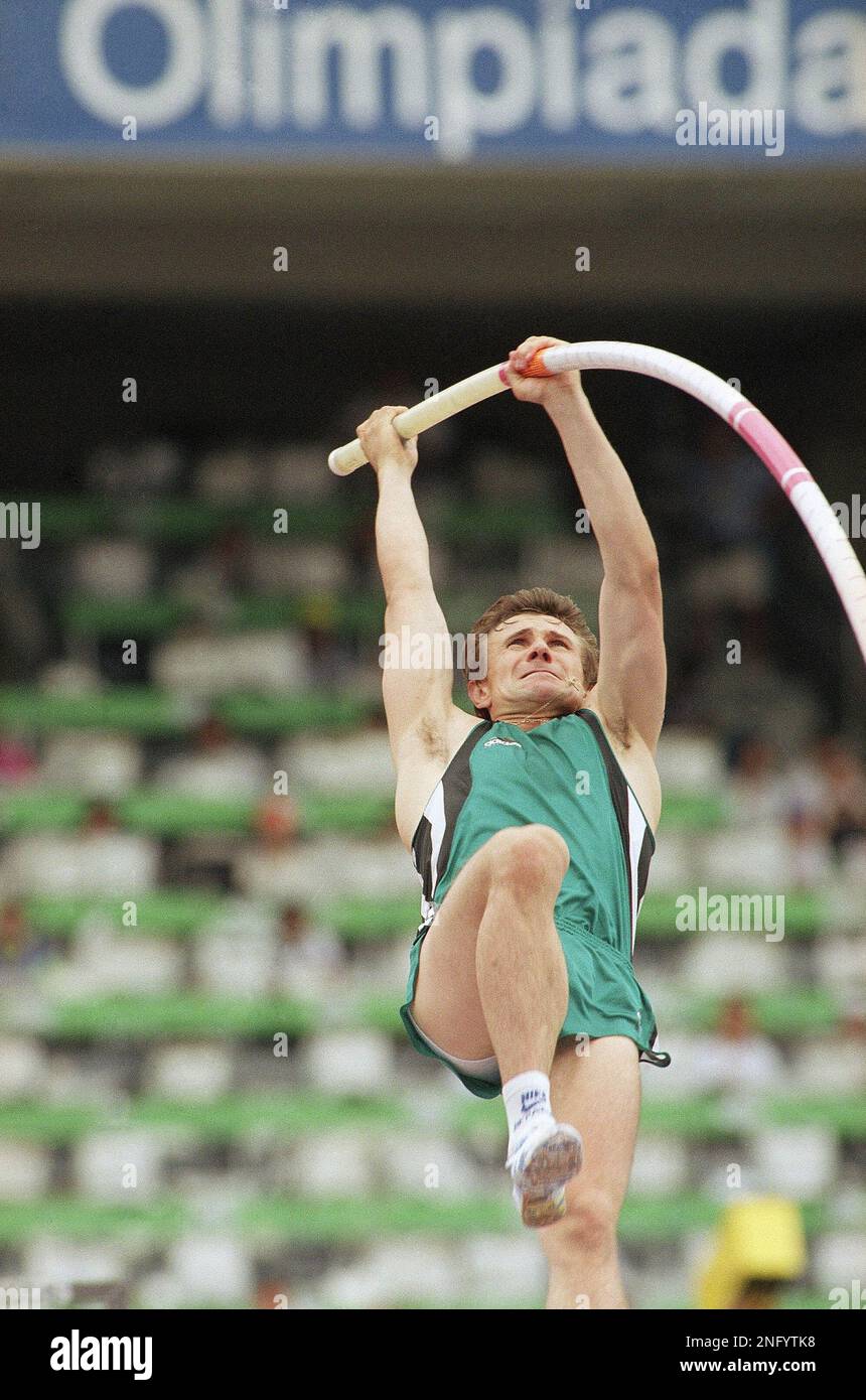 Sergei Bubka of the Unified team, the world record holder in the pole vault, takes off to ...