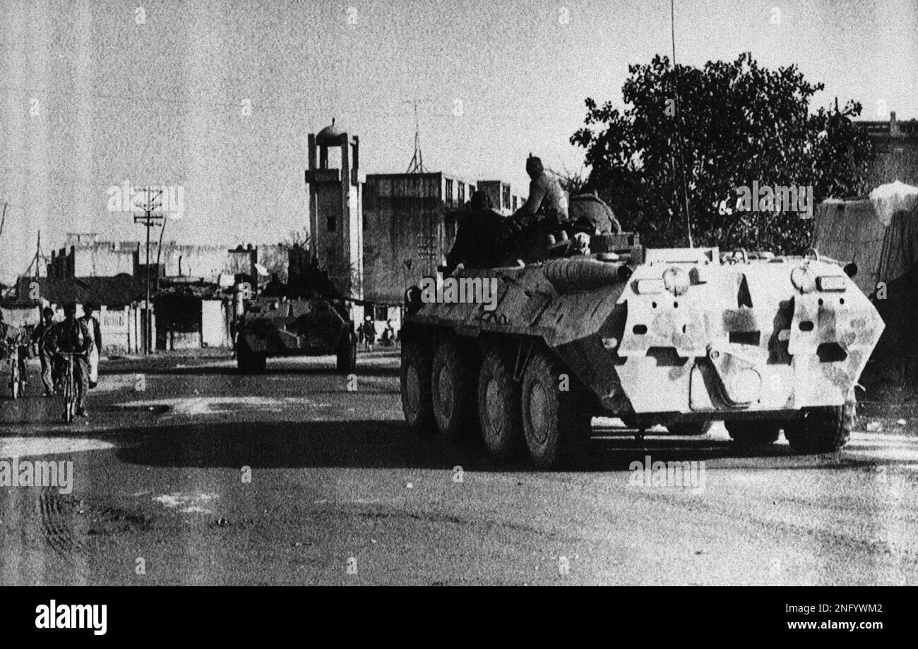 Soviet BTR-60 armored personnel carriers cruise the streets of ...