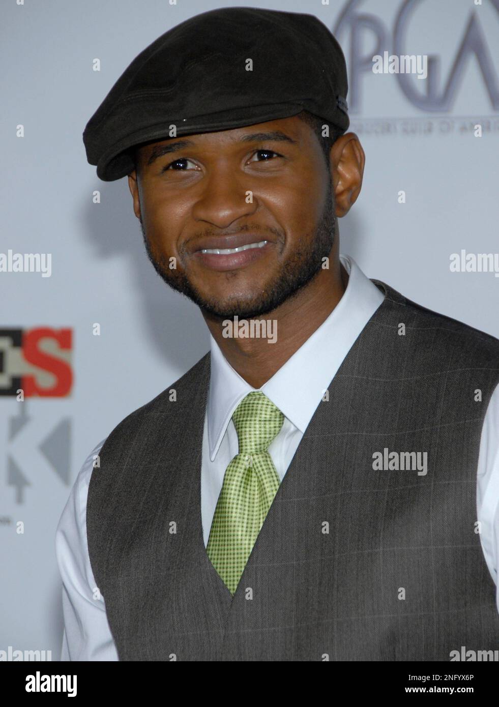 Singer Usher poses on the press line at the Movies Rock celebration at ...
