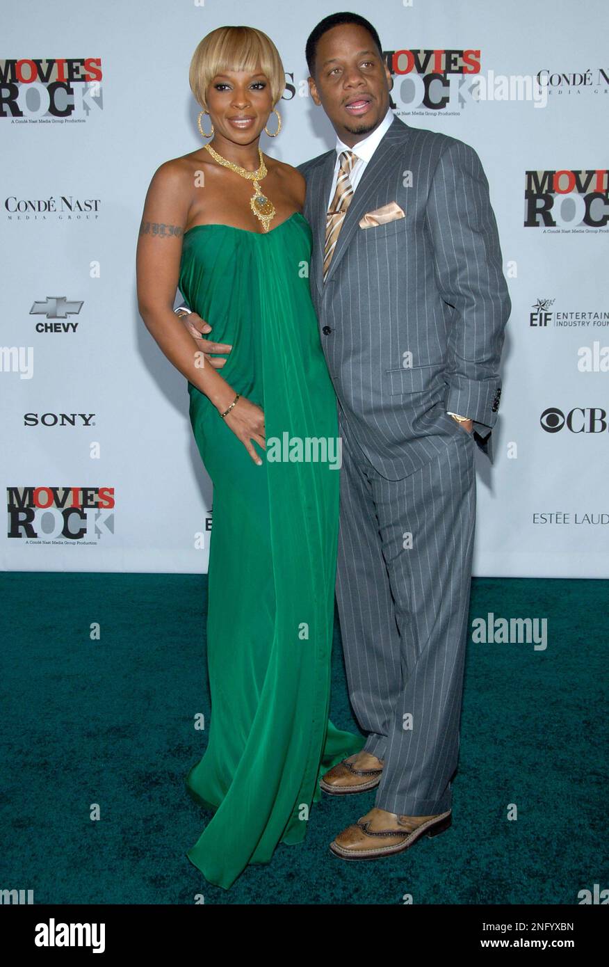 Singer Mary J. Blige, left, and her husband, Martin Kendu Isaacs, right, poses on the press line ...