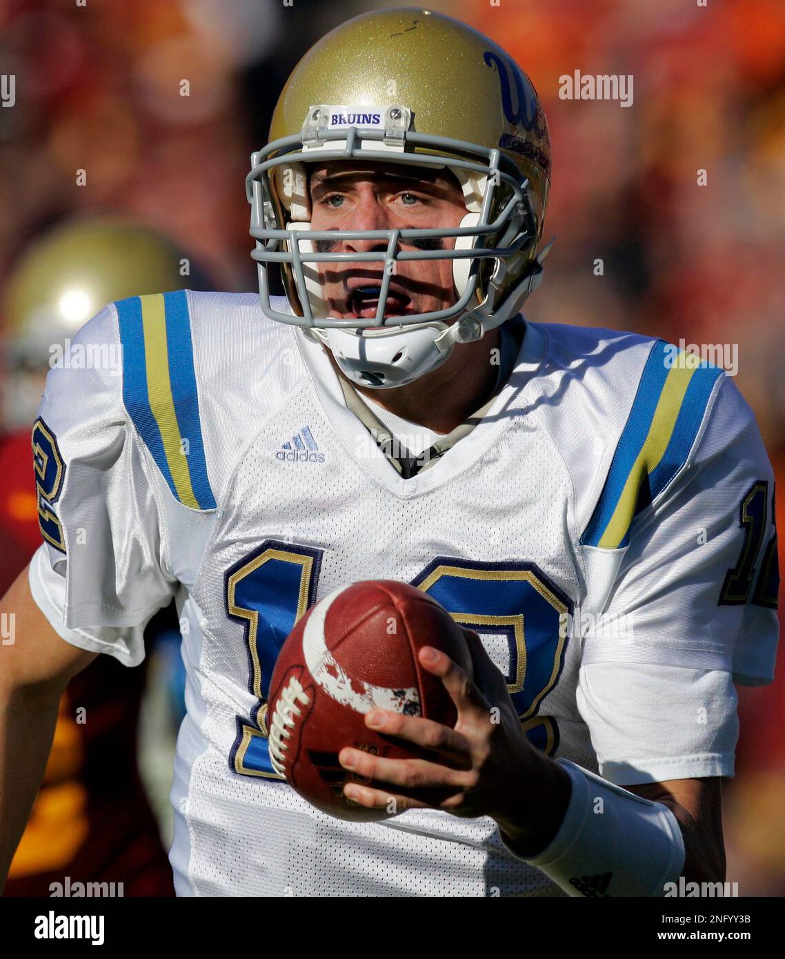 UCLA quarterback Patrick Cowan runs with the ball during the first half ...