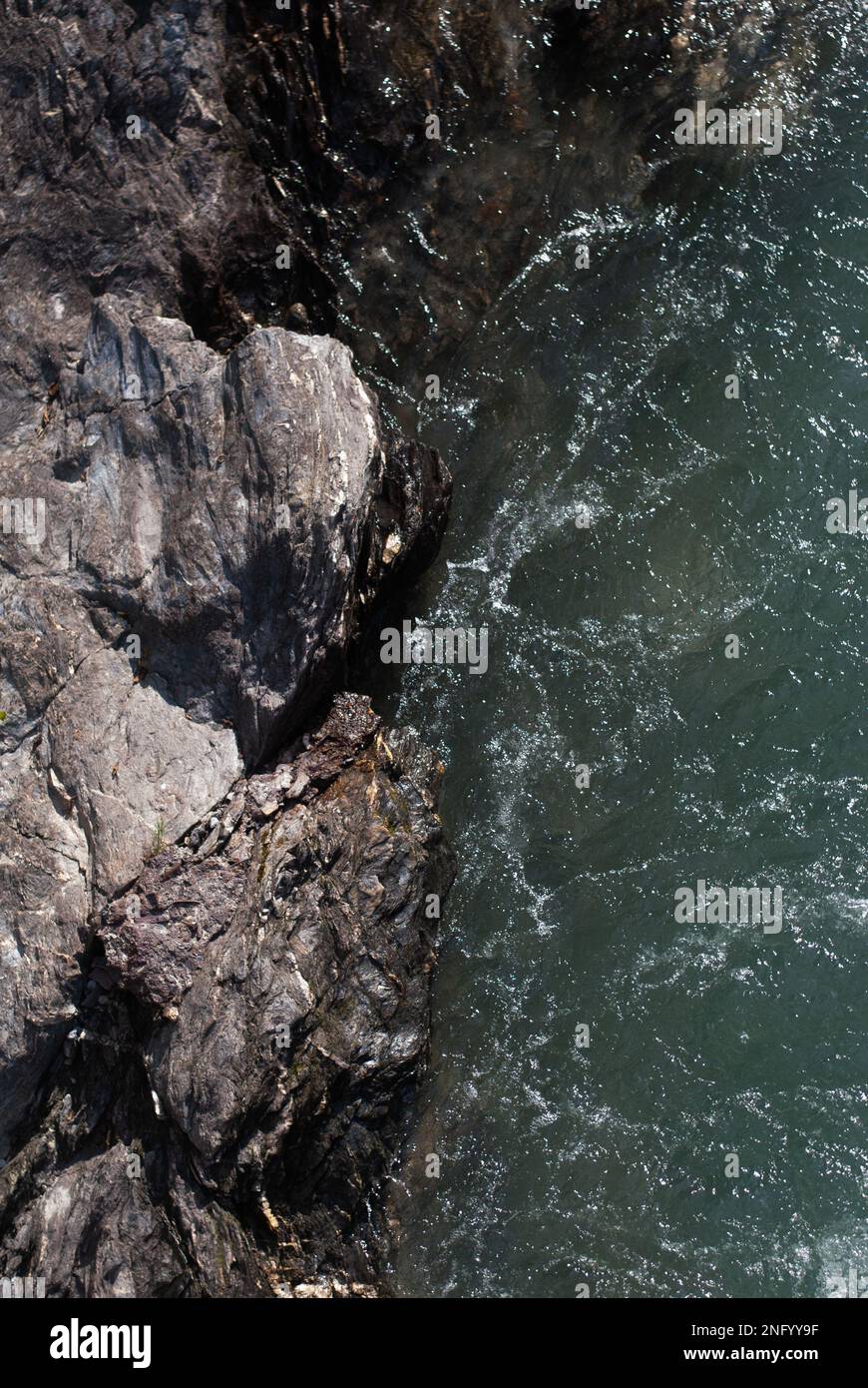 Rock near mountain river with clear water Stock Photo - Alamy