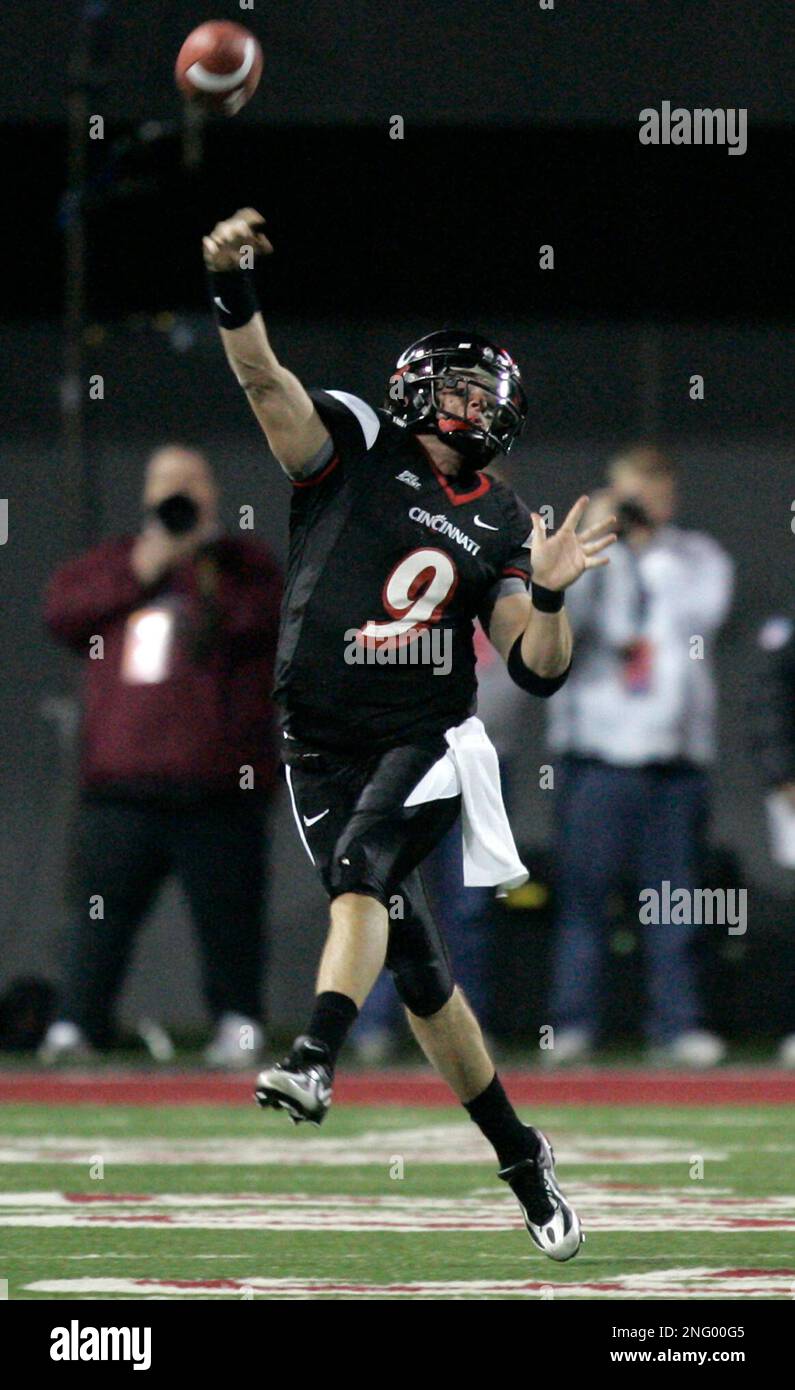 Cincinnati quarterback Ben Mauk throws a touchdown pass against West ...