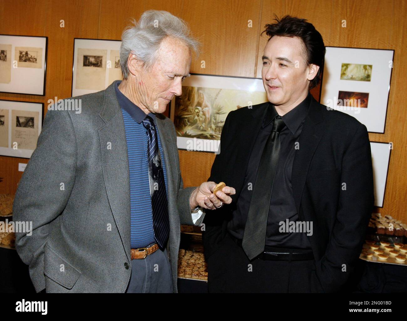 Clint Eastwood, left, and John Cusack are seen at the premiere of ...
