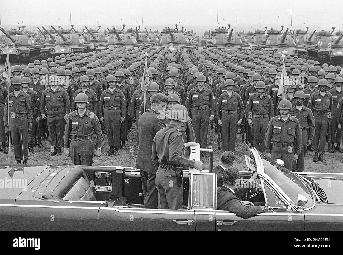 President John F. Kennedy rides with Maj. Gen. John Pugh during ...