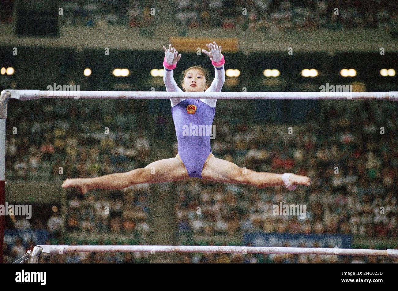 China's Lu Li in gold medal action during the Olympic women's uneven ...