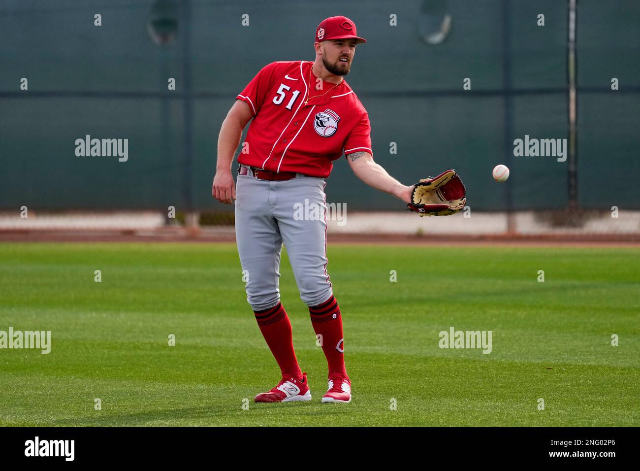 Cincinnati Reds starting pitcher Graham Ashcraft (51) catches a ball ...