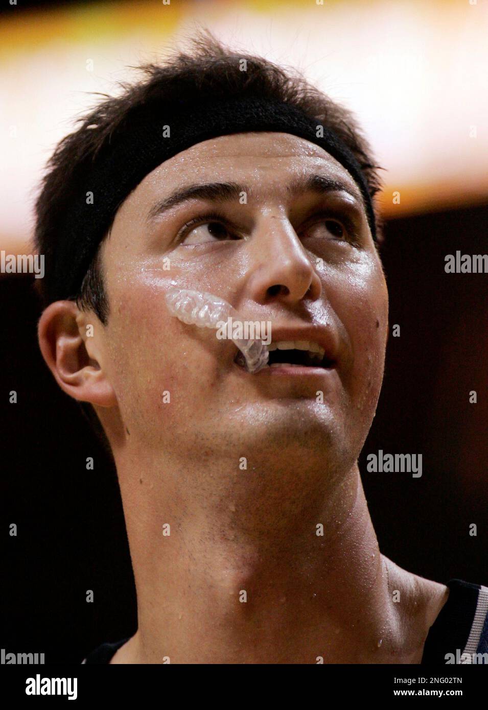 Charlotte Bobcats' Primoz Brezec, of Slovenia, bites on his mouthpiece ...