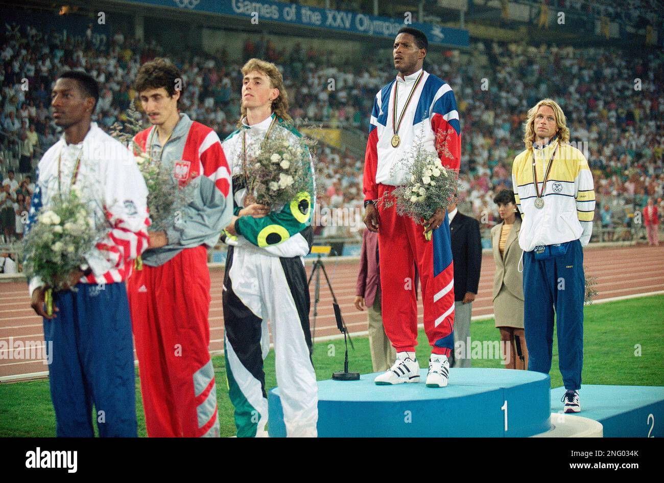 Winners of the men's high jump stand on the award platform during medal ...