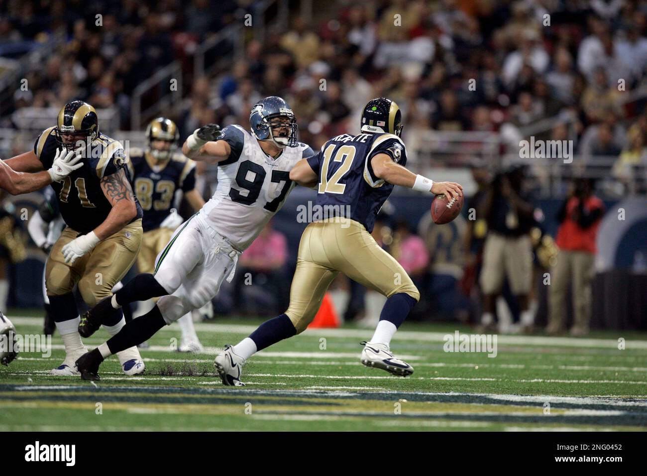 Seattle Seahawks defensive end Patrick Kerney (97) sacks St. Louis Rams ...