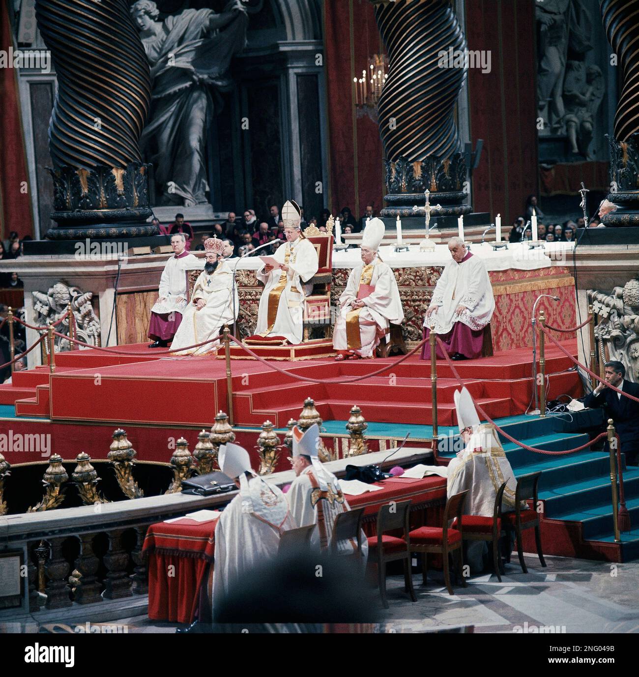 Pope Paul VI proclaims the last decrees of the Roman Catholic Ecumenical Council, sitting on his ...