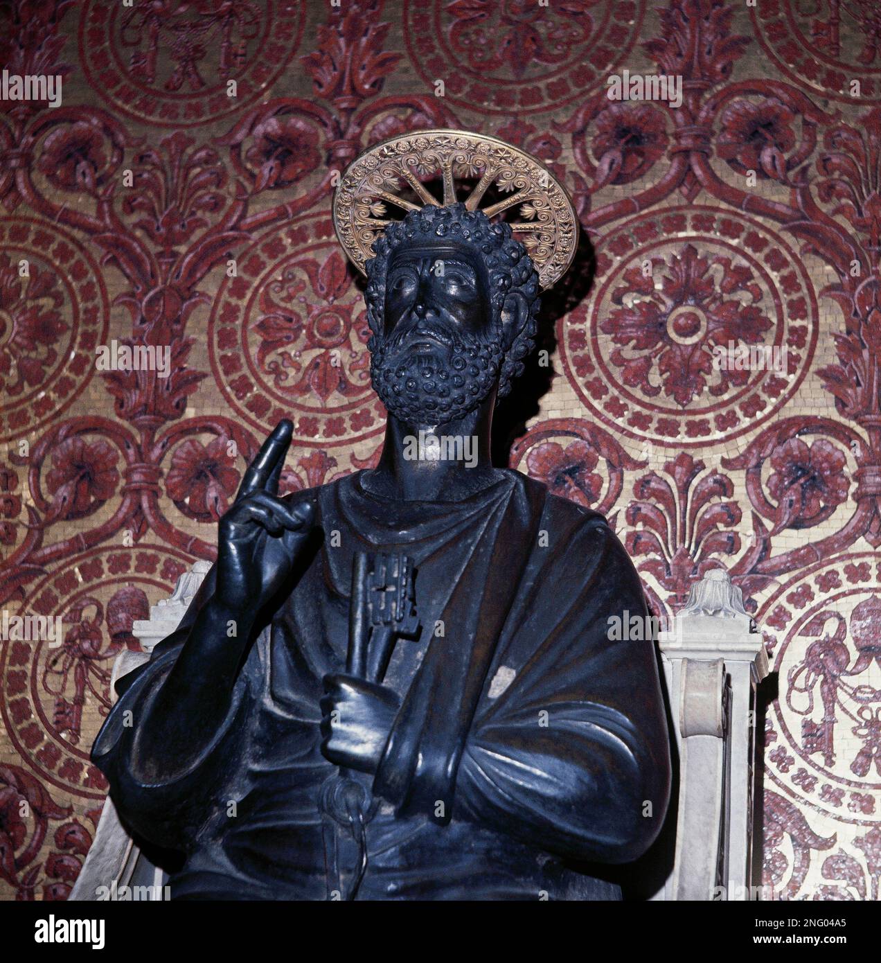 Seen here is the famous bronze statue of St. Peter, sitting on a white ...