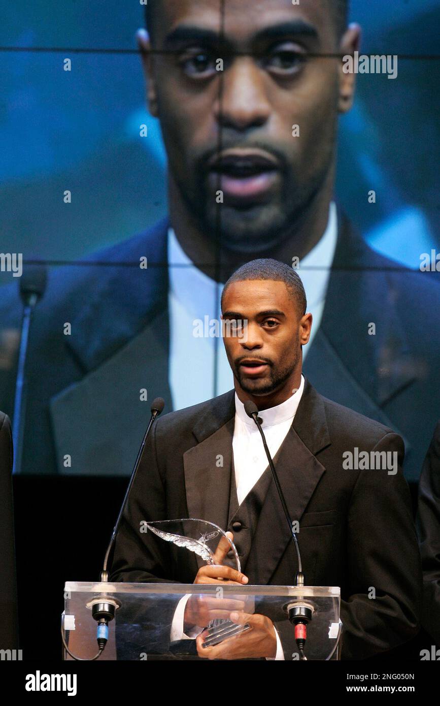 U.S. world champion sprinter Tyson Gay holds his "Athlete of the Year ...