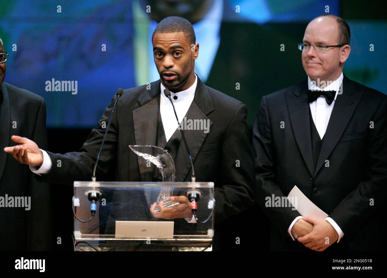 U.S. world champion sprinter Tyson Gay holds his "Athlete of the Year ...