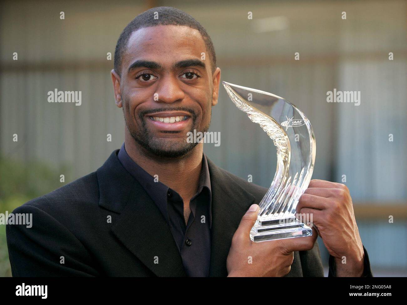 U.S World champion Tyson Gay holds his "Athlete of the Year Award ...