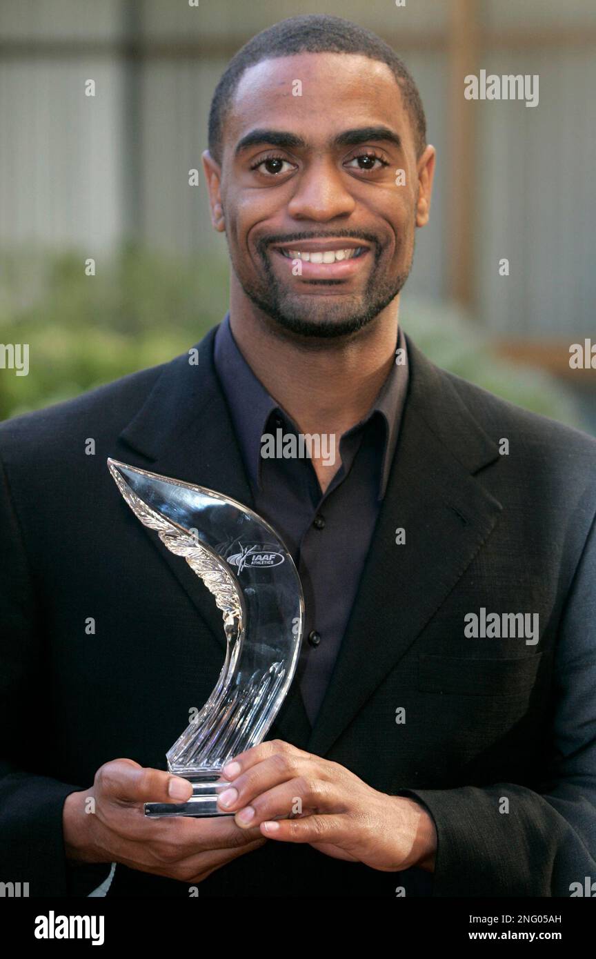 U.S World champion Tyson Gay holds his "Athlete of the Year Award ...
