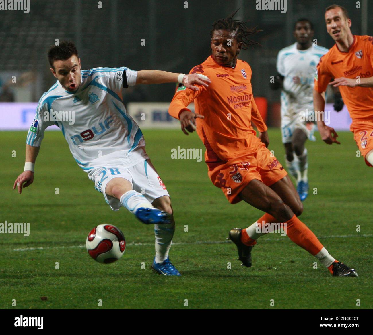 Marseille's forward Mathieu Valbuena, left, challenges with Metz's ...