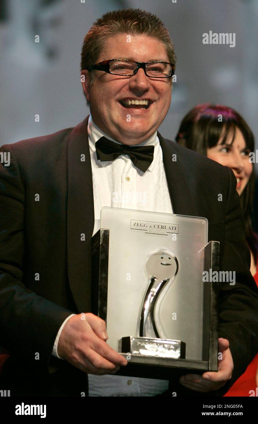 Irish actor Pat Schortt holds his best actor's award during the award ...