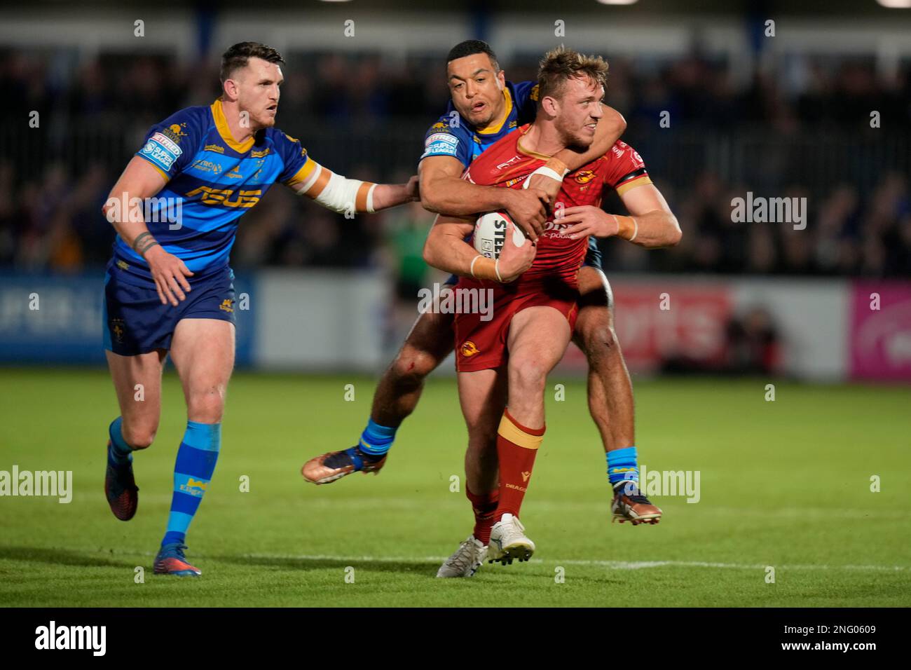 Reece Lyne #4 and Lee Gaskell #6 of Wakefield Trinity try to tackle ...