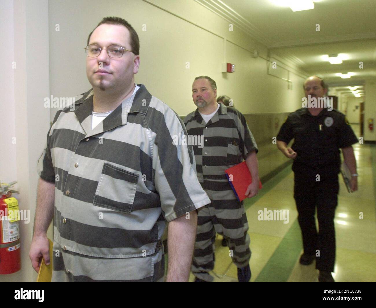 Michael Slover Jr., left, his father, Michael Slover Sr., middle, and ...