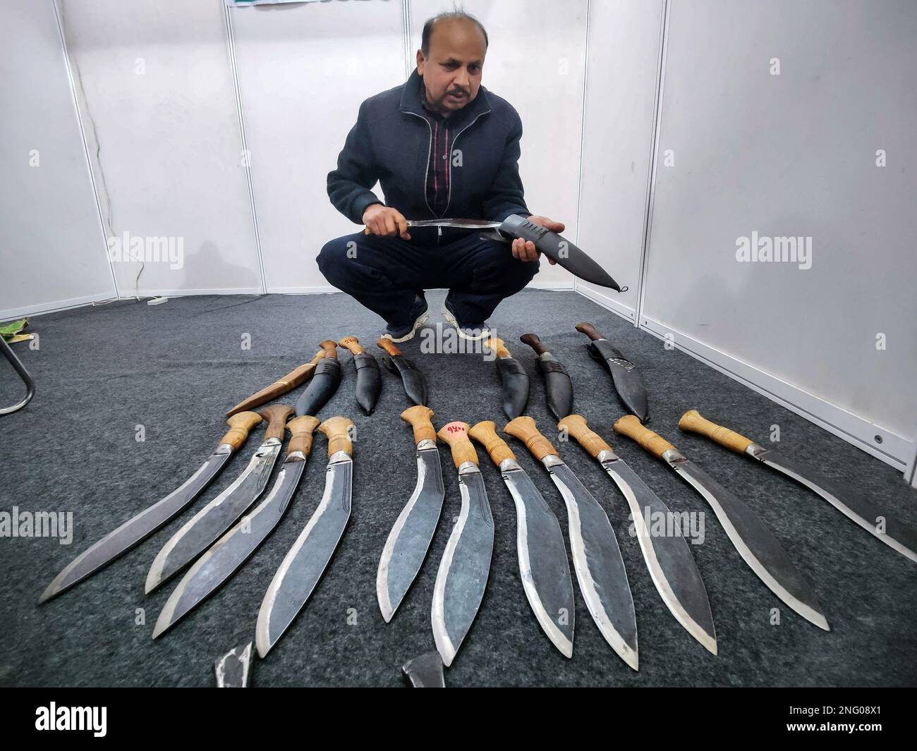 Kathmandu, Bagmati, Nepal. 17th Feb, 2023. A visitor looks the Khukuris ...