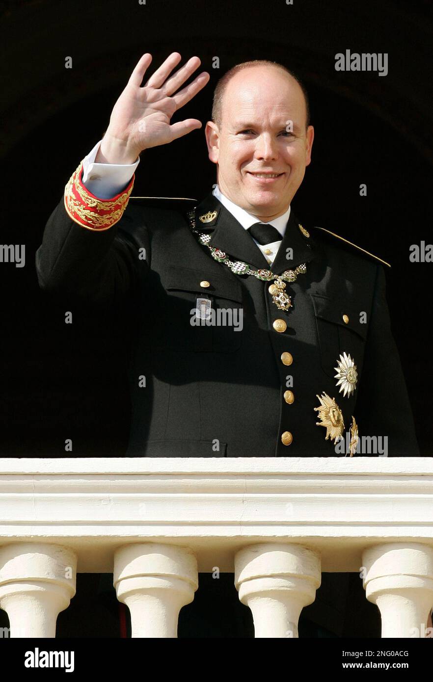 Prince Albert II of Monaco waves from the Monaco palace during country ...