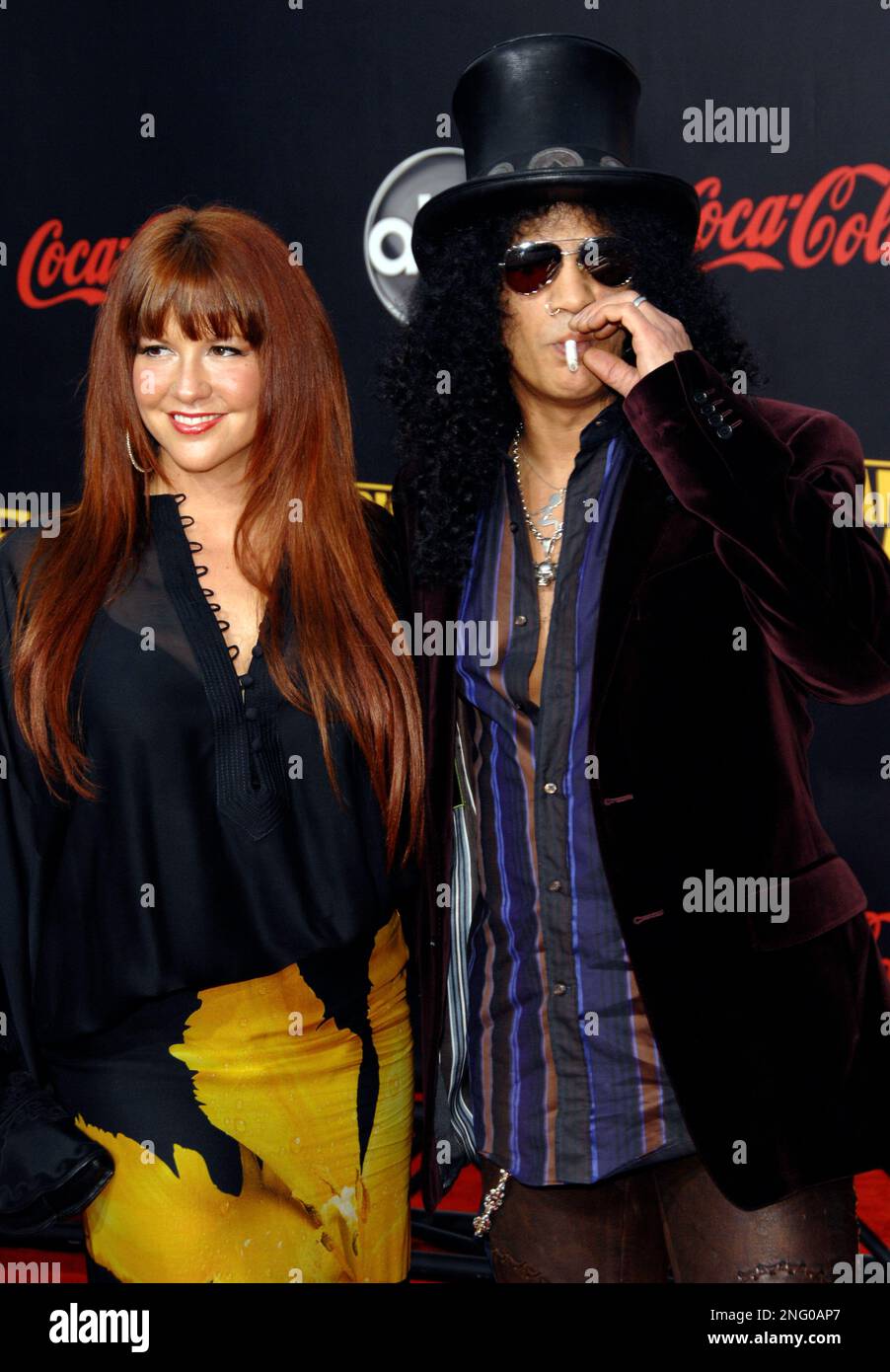 Perla Ferrar and guitarist Slash arrives at the American Music Awards ...