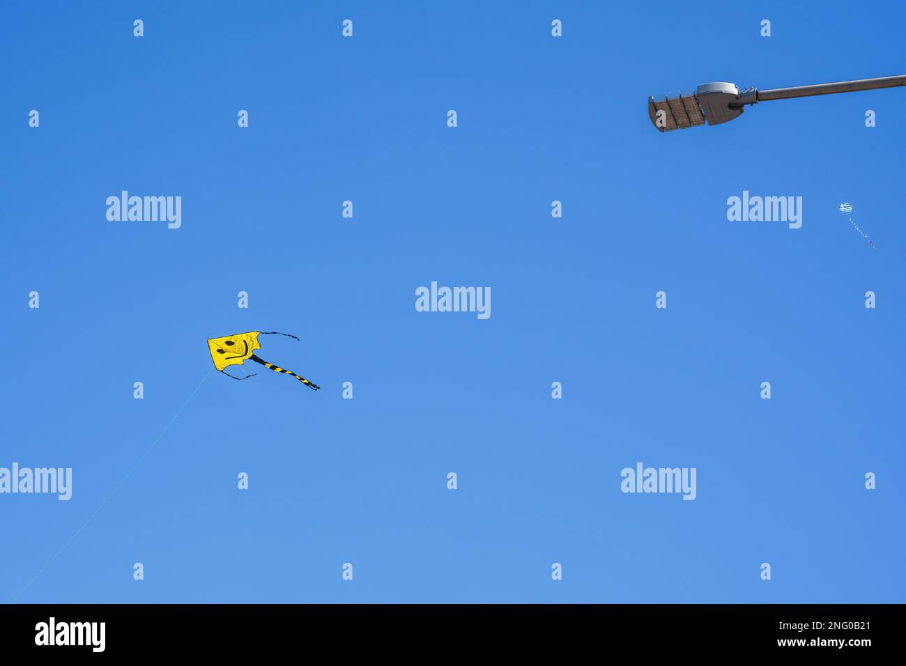 Colorful kite soars high in the sky Blue sky. Sports kite festival ...