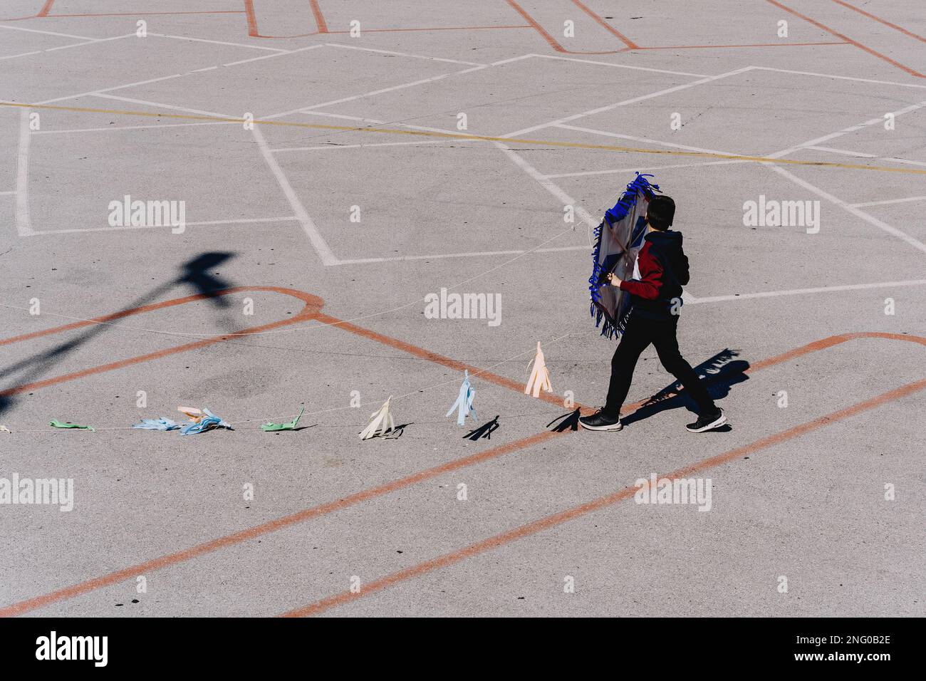 Boy flying a kite into the sky. Blue sky. Sports kite festival. Clean ...