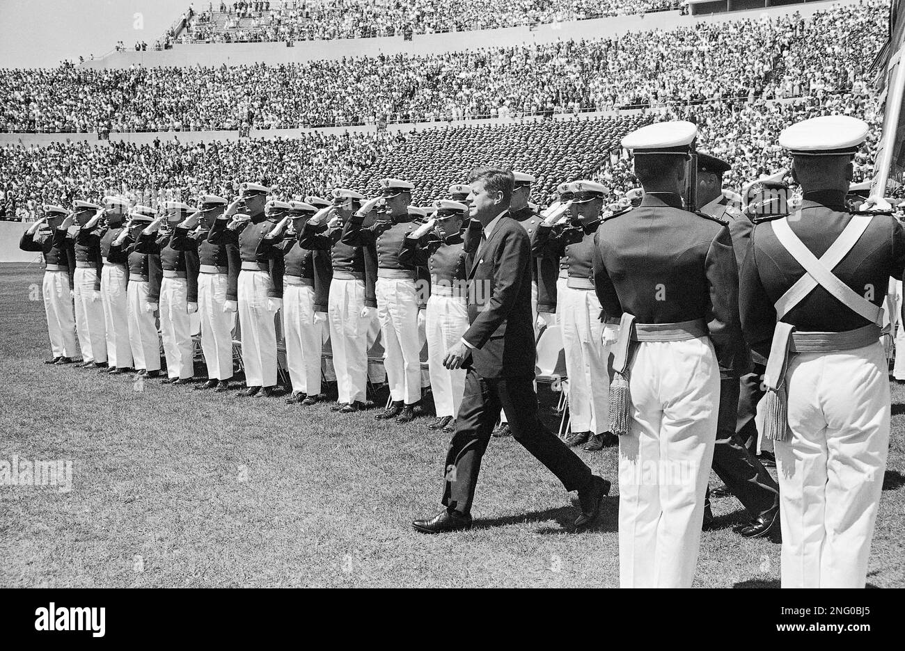 Graduates of the U.S. Air Force Academy stand rigidly at attention as ...