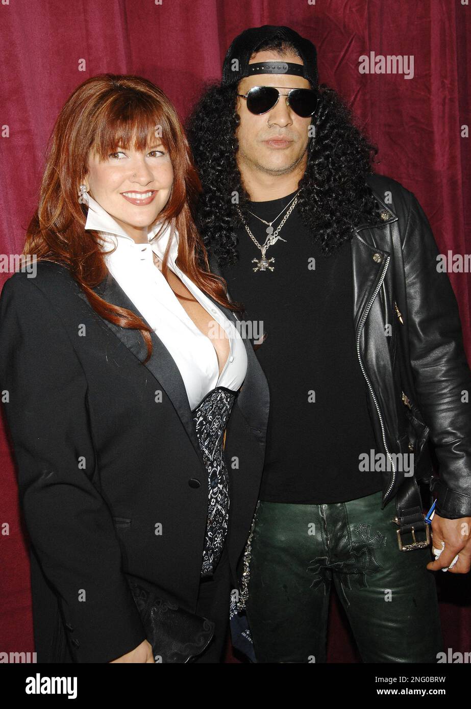 Guitarist Slash and wife Perla Ferrar arrive at the Victoria's Secret ...