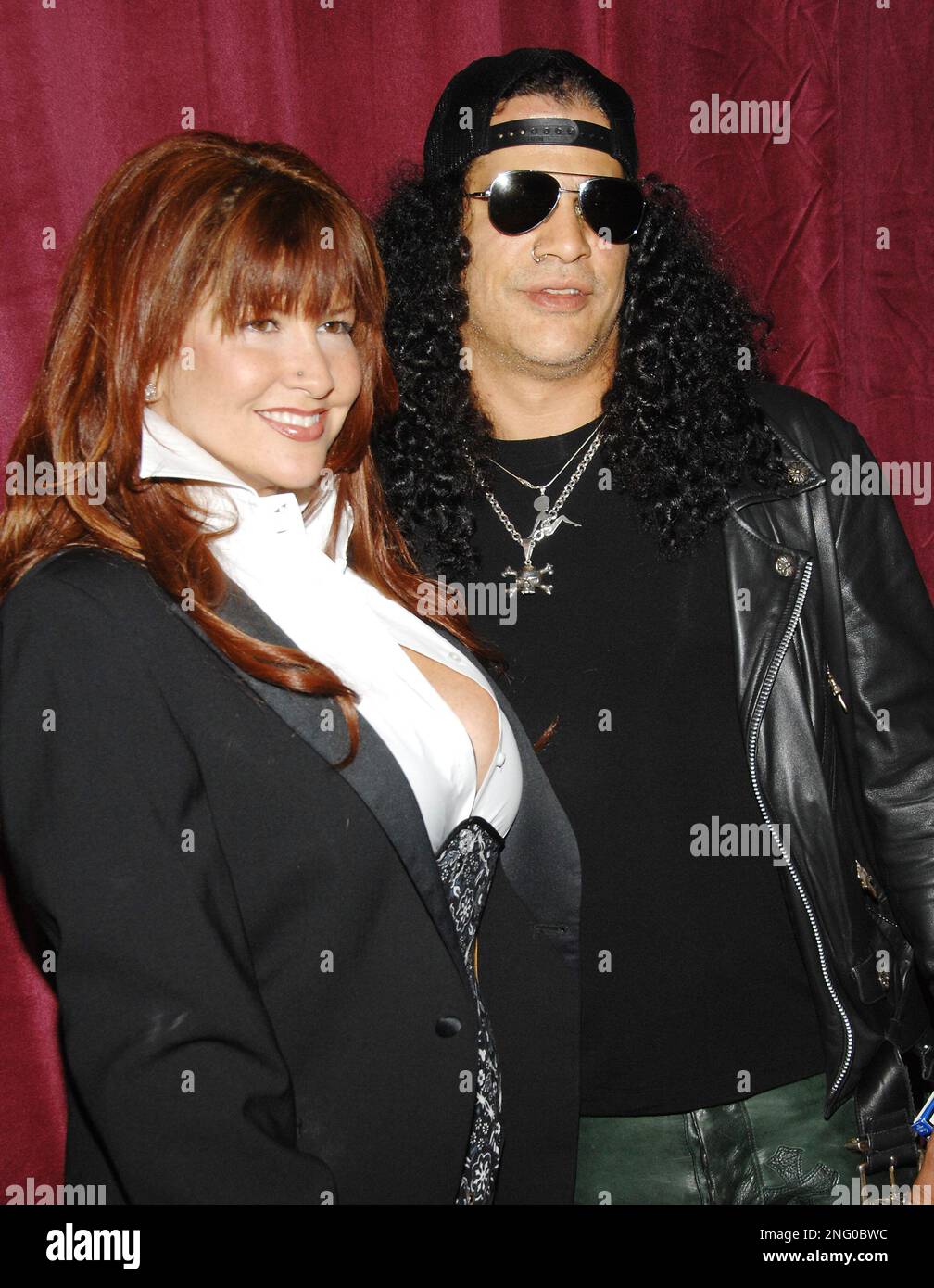 Guitarist Slash and wife Perla Ferrar arrive at the Victoria's Secret ...