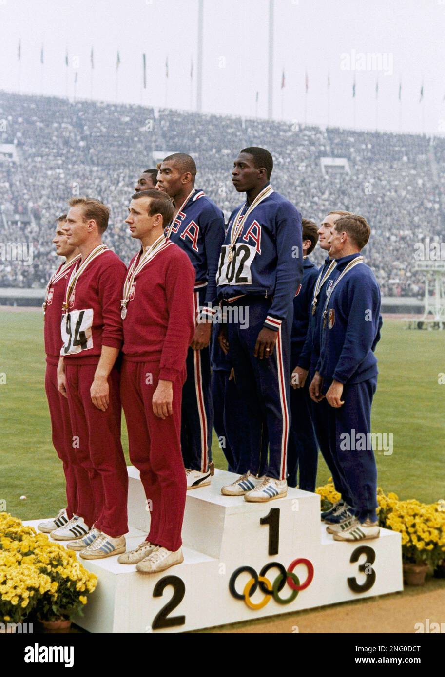 Standing on the podium after receiving their medals are the men's 400 ...
