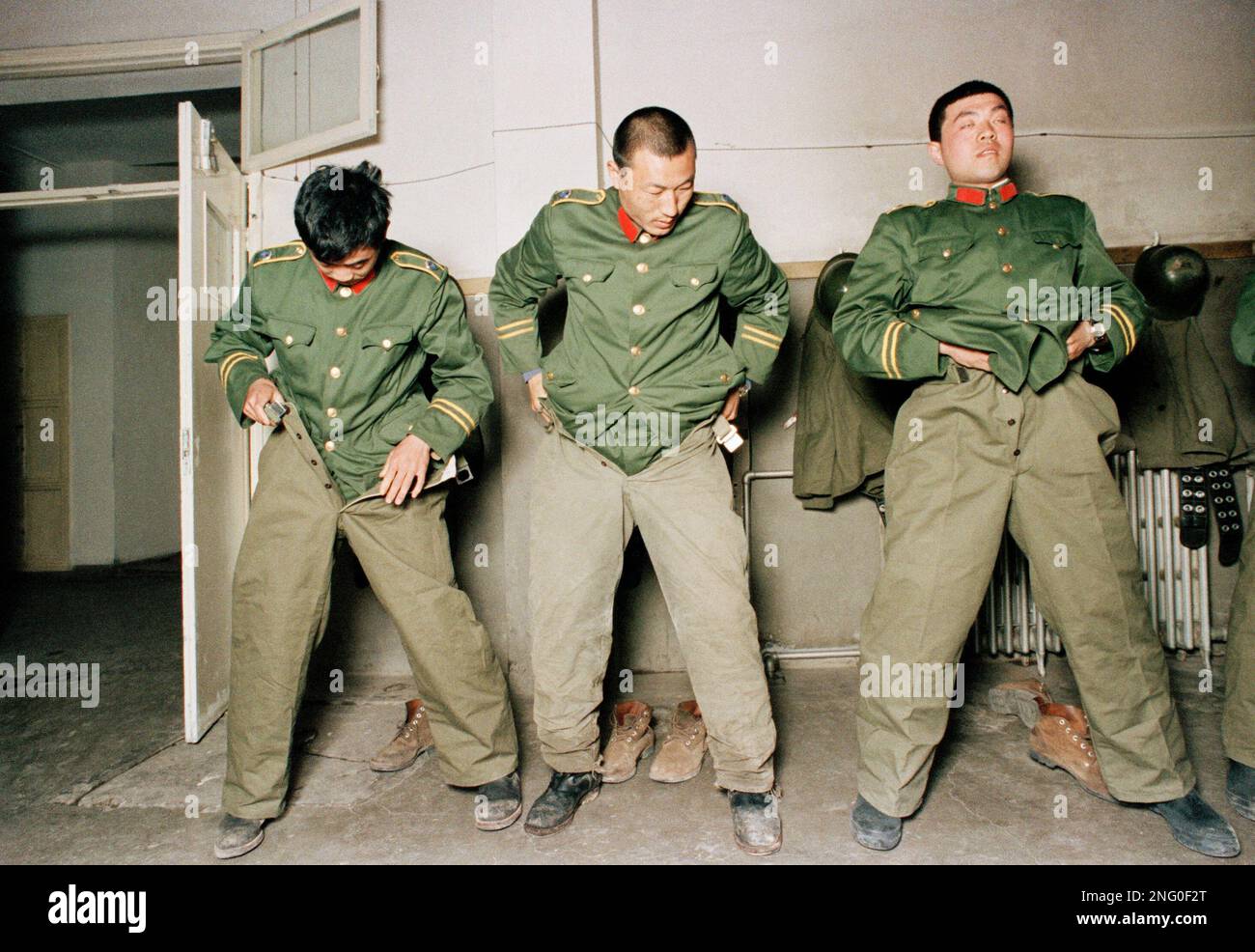 Firemen in Beijing, China putting on their fire fighting uniforms ...
